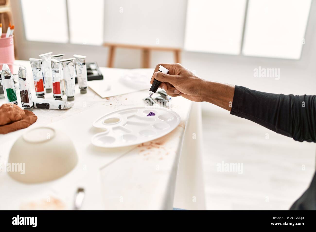 Hand of african american artist man painting at art studio Stock Photo ...