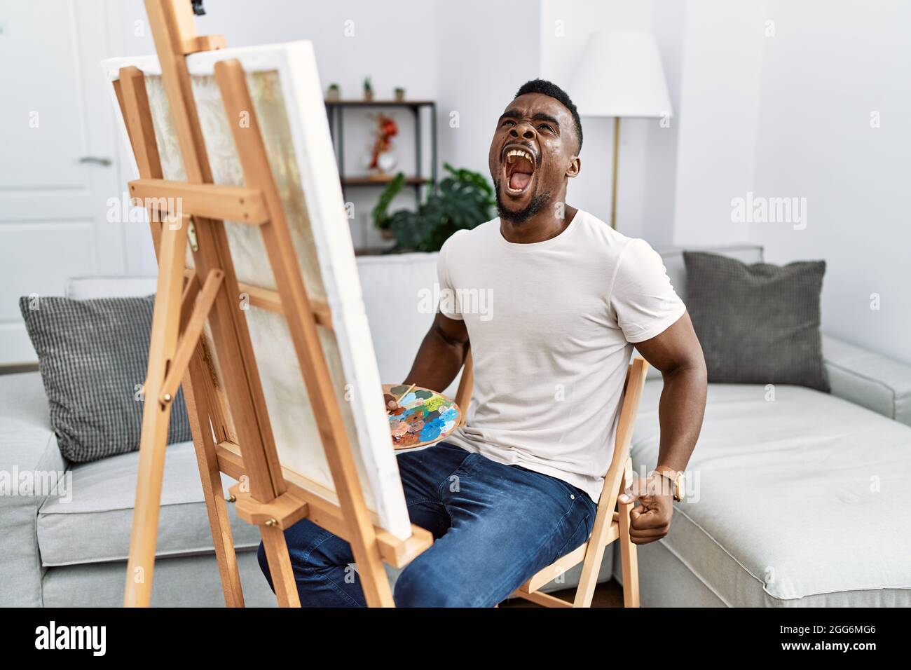 A Person Painting On A Canvas