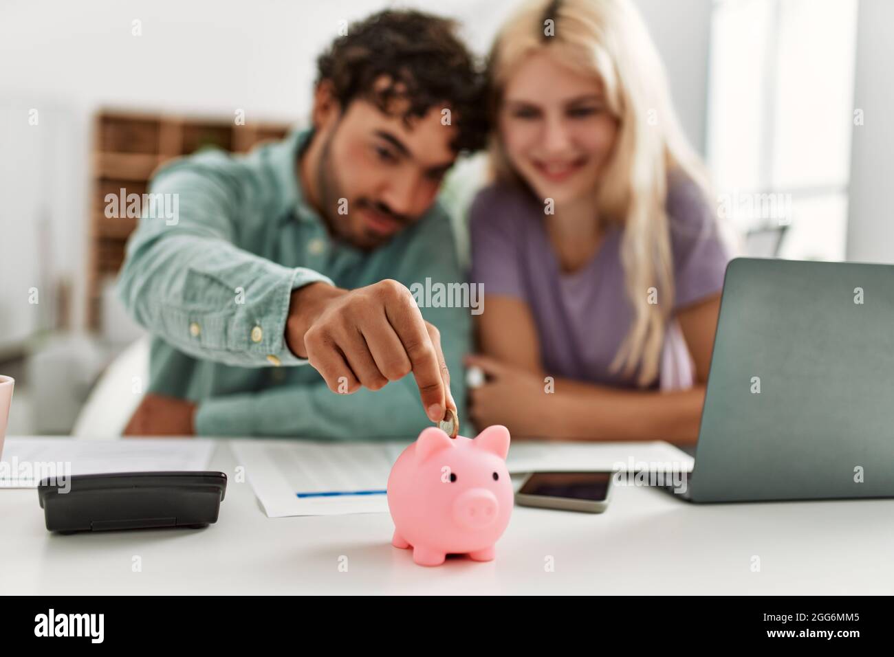 Young couple controlling family economy at home Stock Photo - Alamy