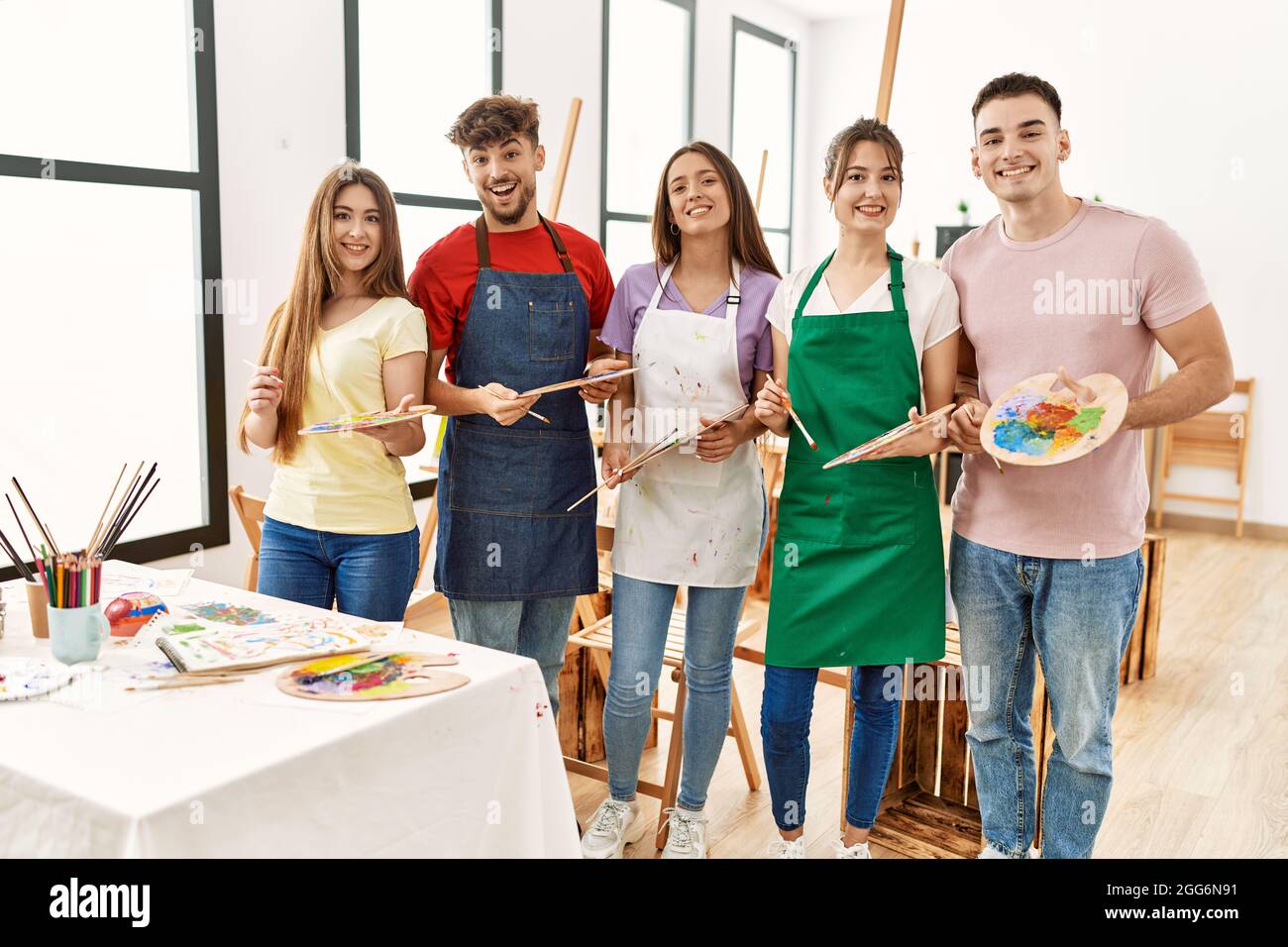 Group of people smiling happy drawing at art studio Stock Photo - Alamy