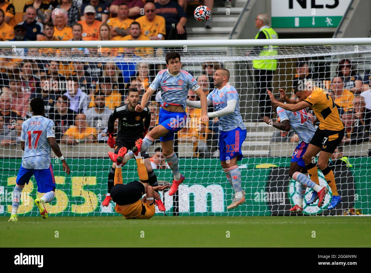 Harry Maguire #5 of Manchester United makes a defensive clearance Stock ...
