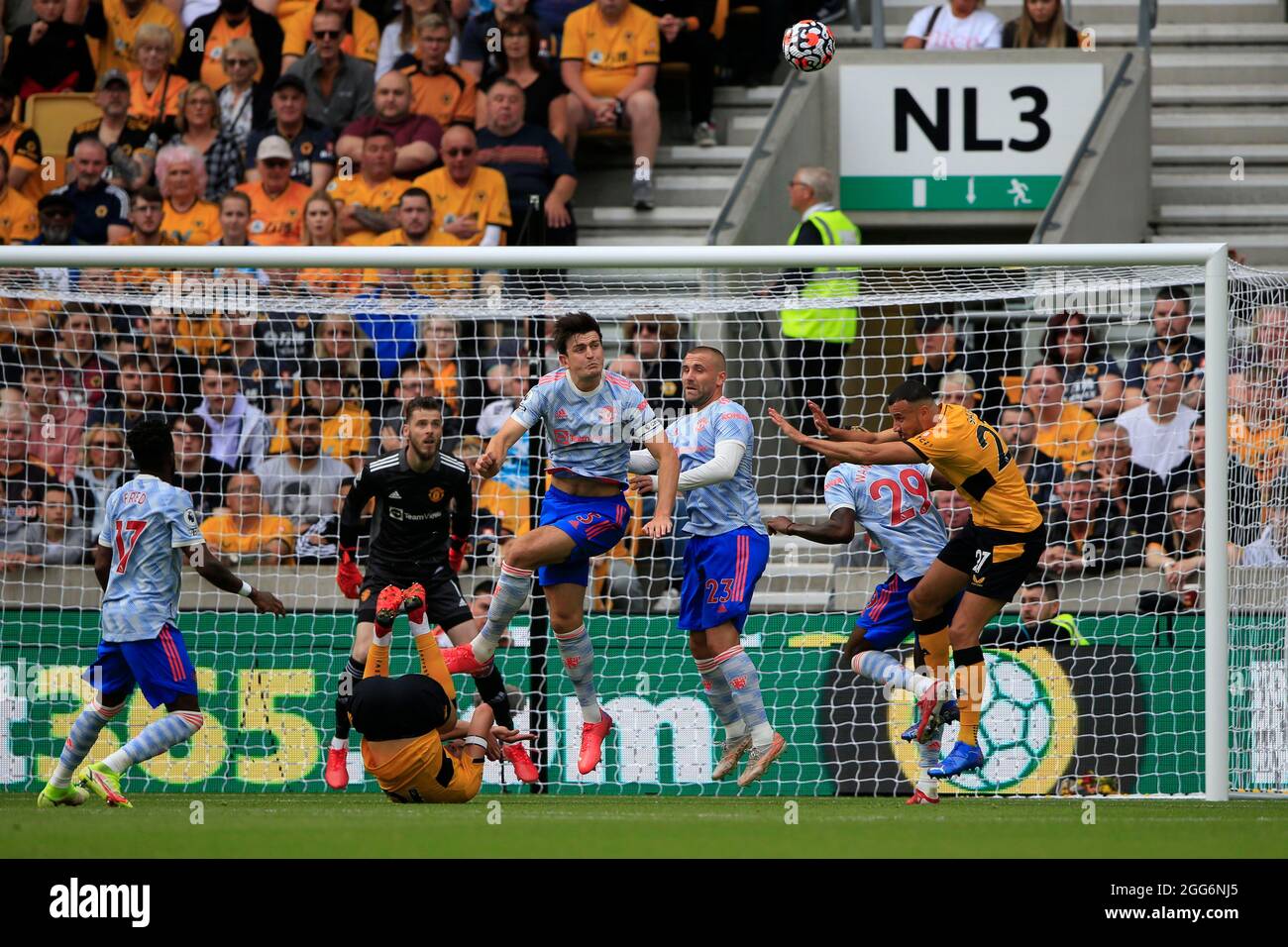 Harry Maguire #5 of Manchester United makes a defensive clearance Stock ...