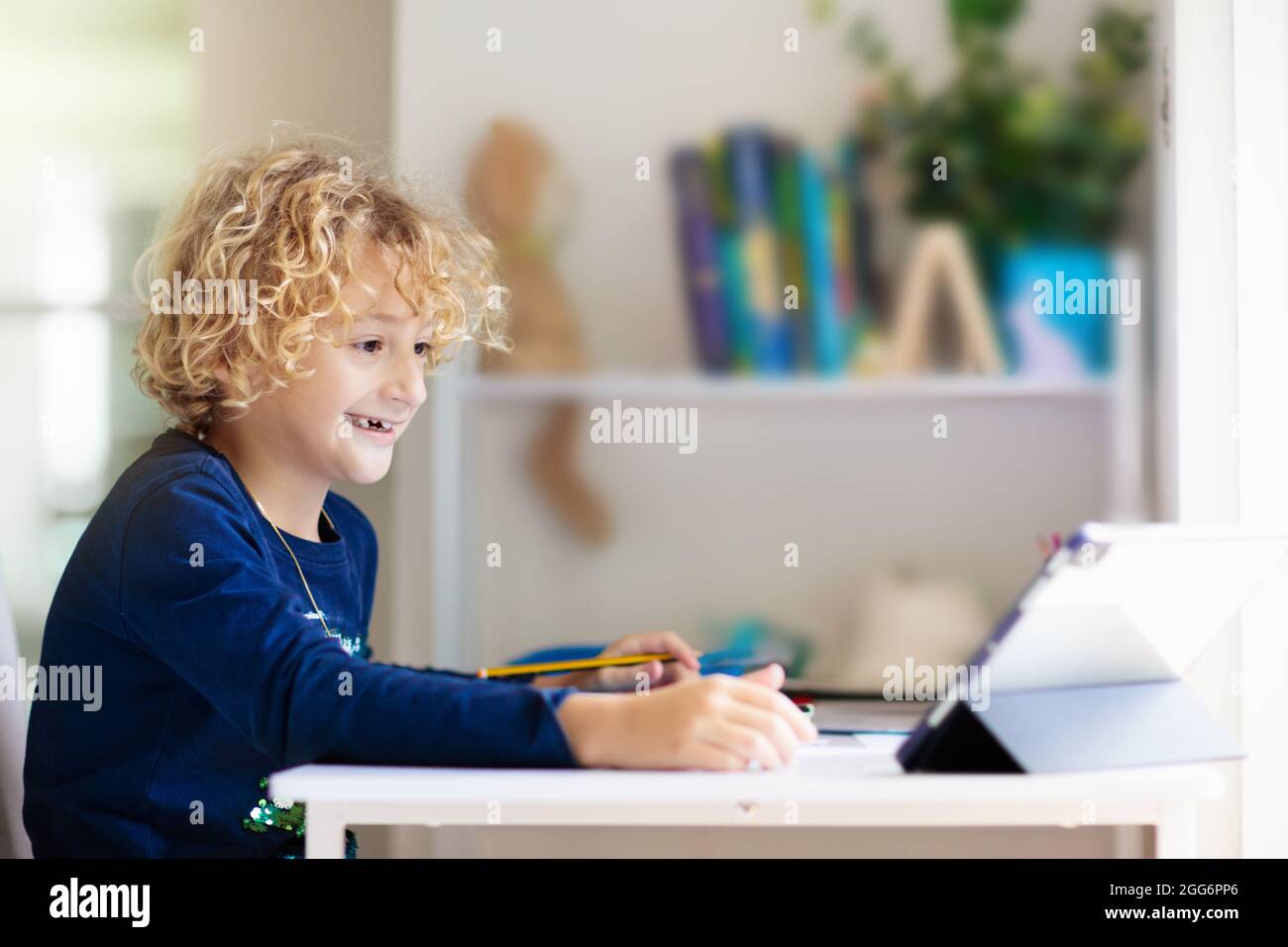 Online remote learning. School kids with computer having video ... Online remote learning. School kids with computer having video ...