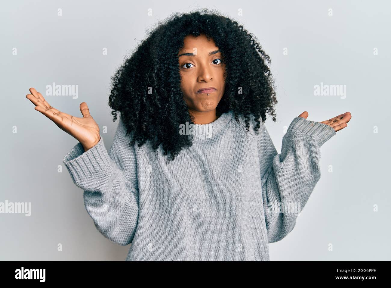 African american woman with afro hair wearing casual winter sweater ...