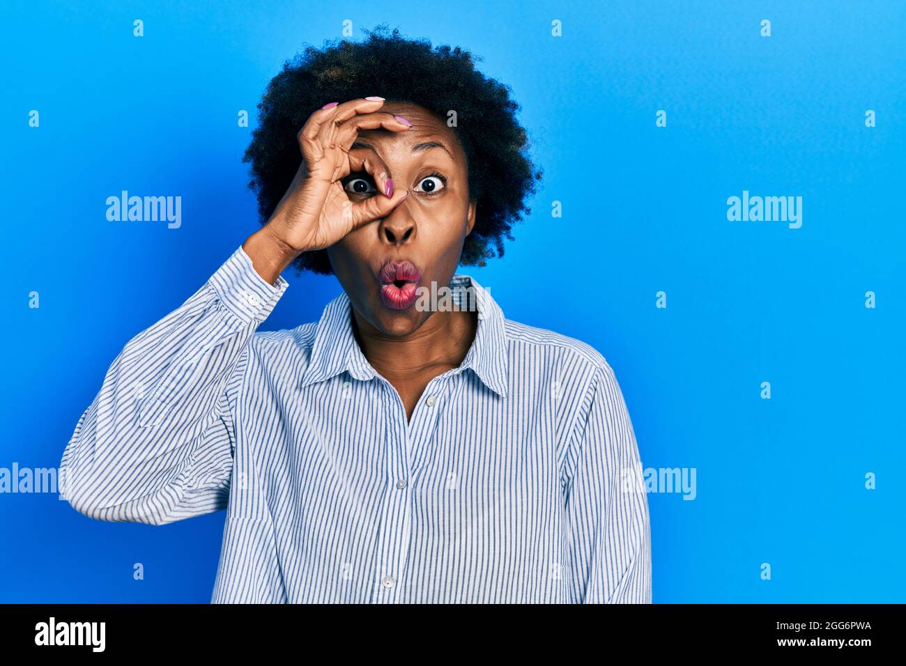Young african american woman wearing casual clothes doing ok gesture ...