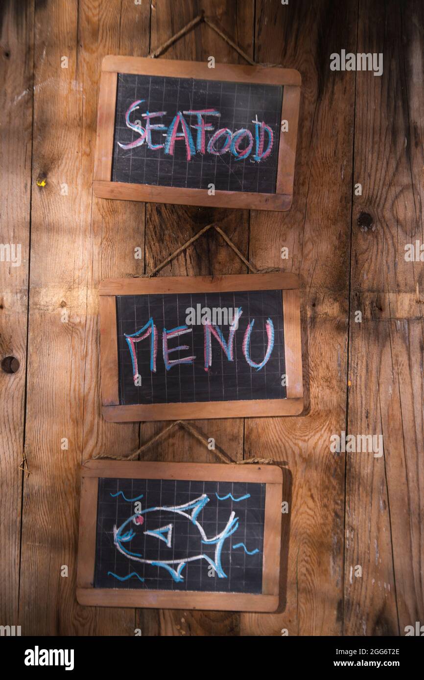 Sign for advertising menu a restaurant serving fish Stock Photo - Alamy