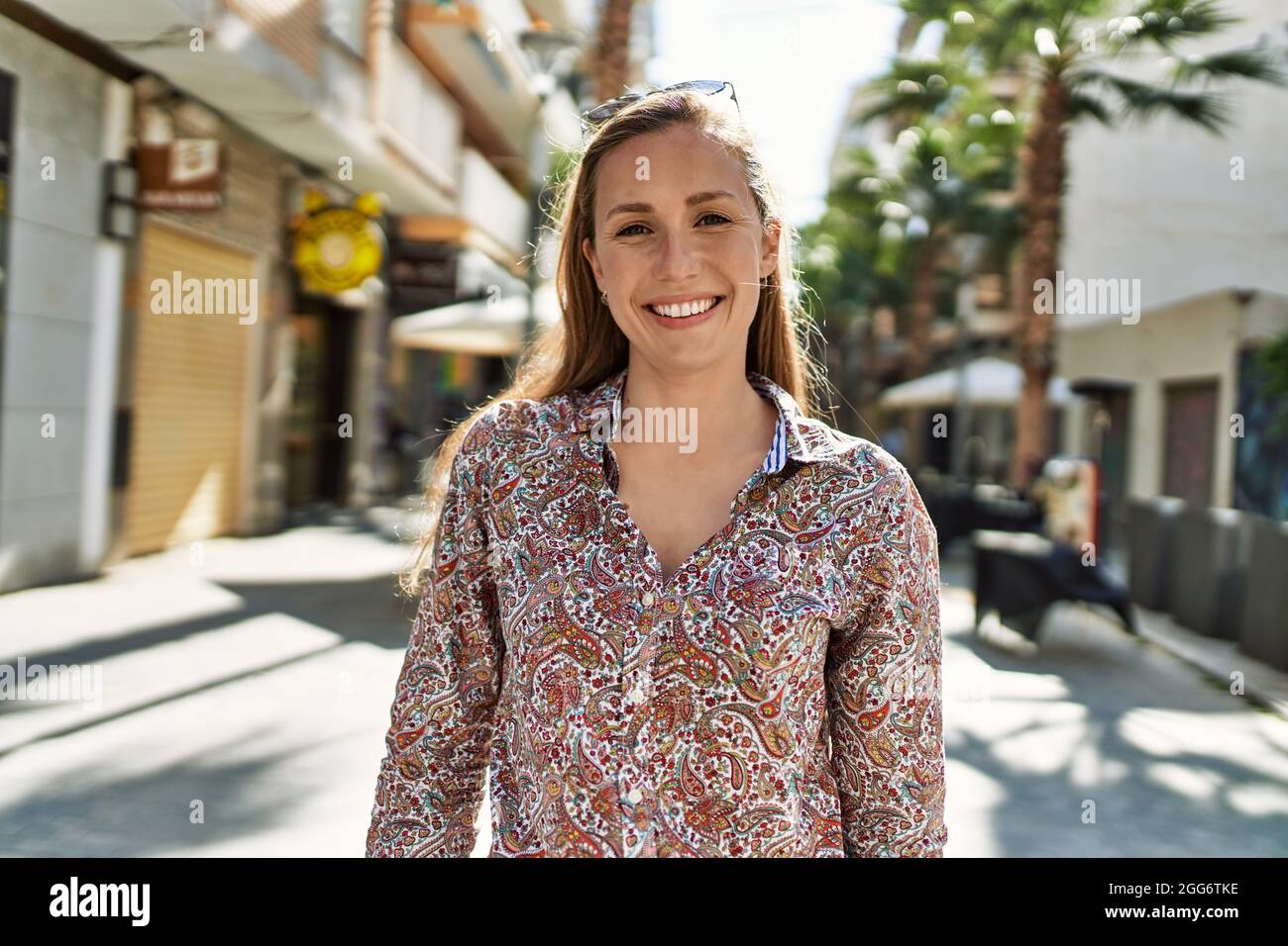 young irish girl smiling happy standing at the city Stock Photo - Alamy