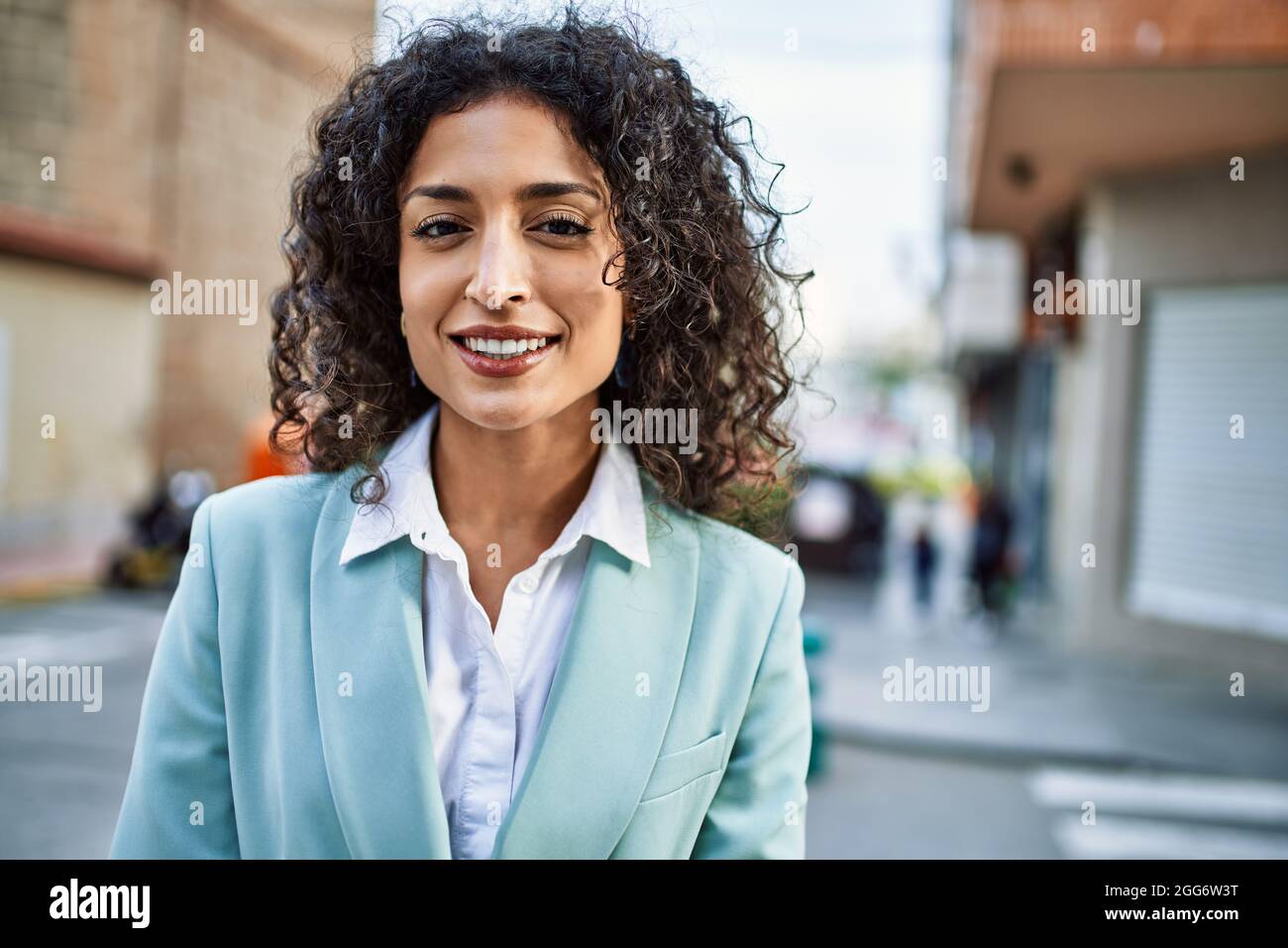 Young hispanic business woman wearing professional look smiling ...