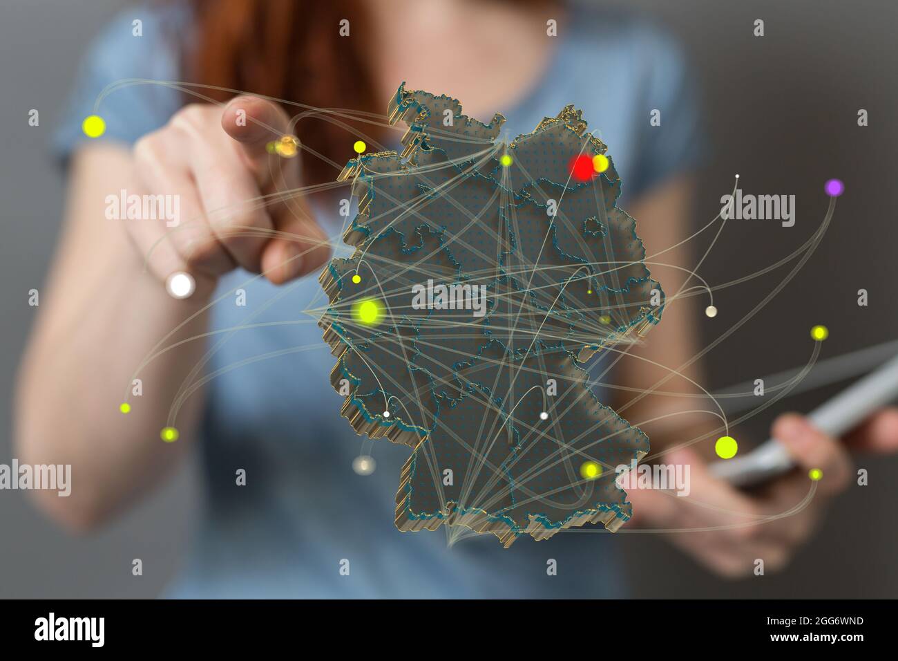 A woman pointing to a digital German map Stock Photo - Alamy
