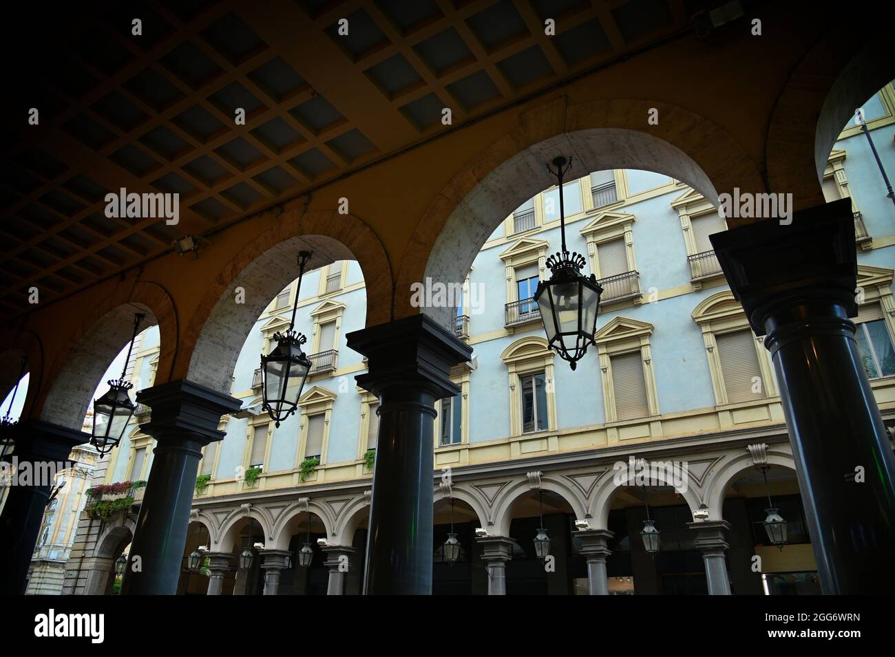A glimpse of ancient downtown arcades in Rome street, Turin, Italy ...