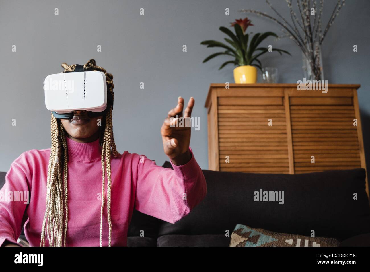 African girl playing vr console games wearing virtual reality goggles ...