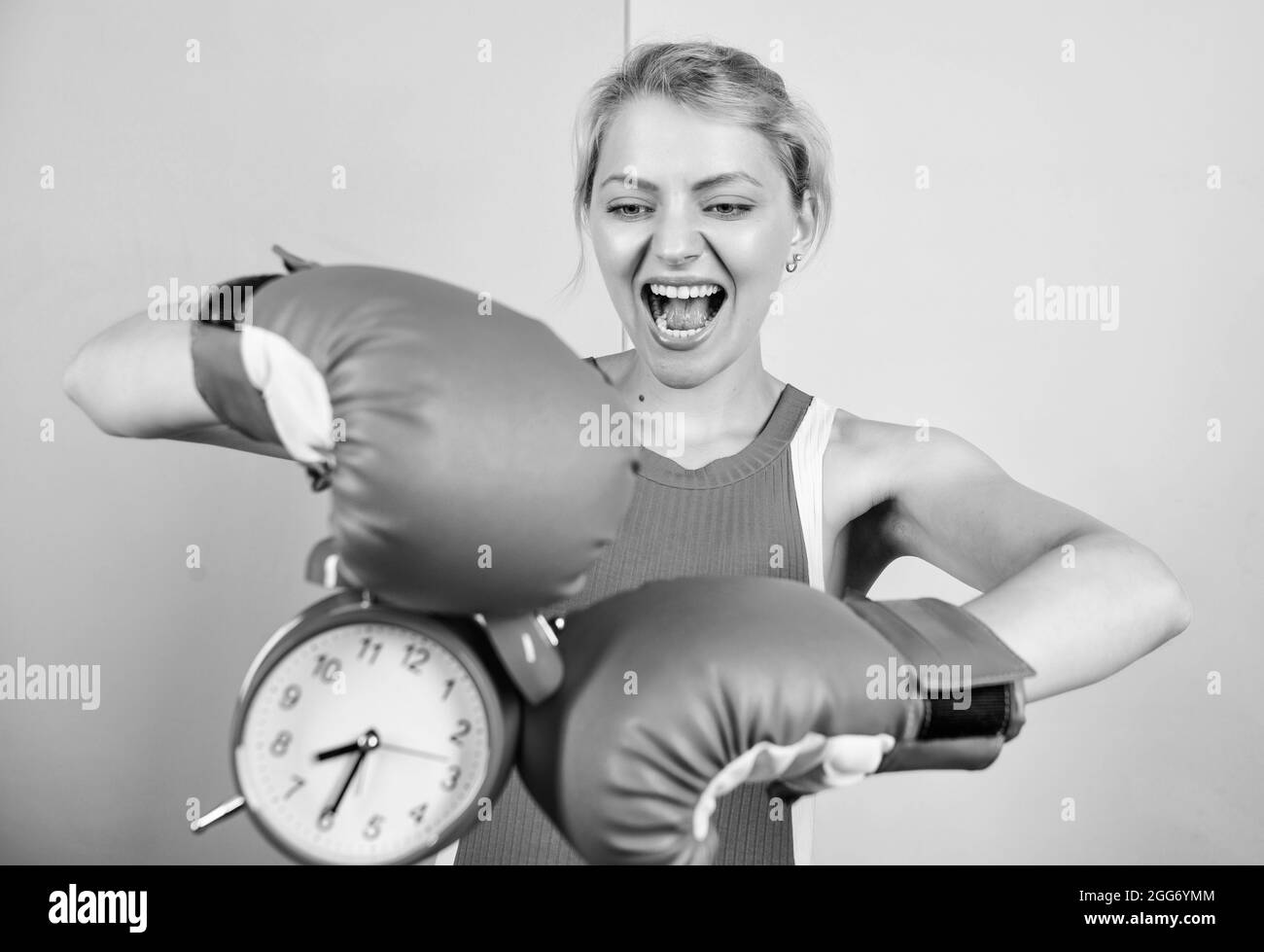 fighting with alarm clock. time to fight. time for success. win the day ...