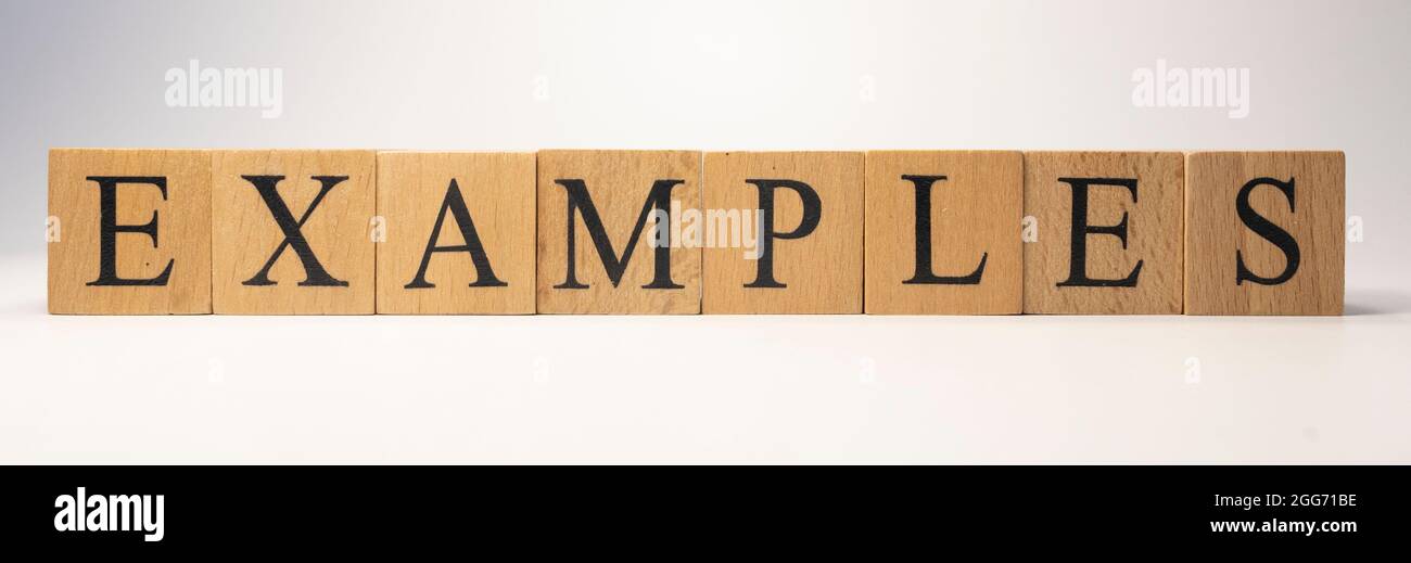 The word examples was created from wooden cubes. business and planning ...