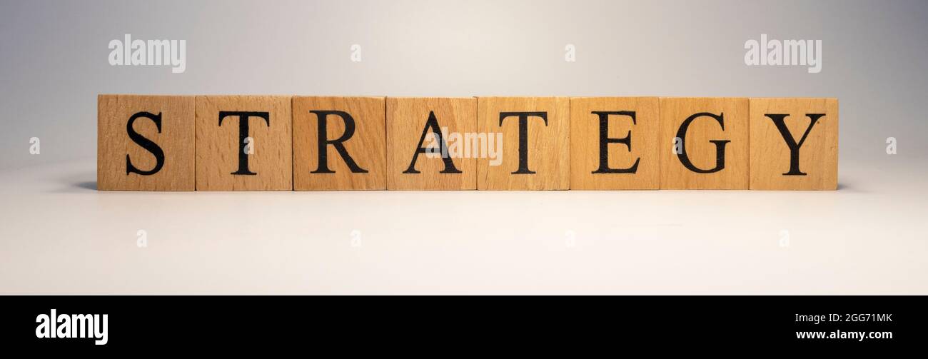 The word Strategy was created from wooden cubes. close up Stock Photo ...
