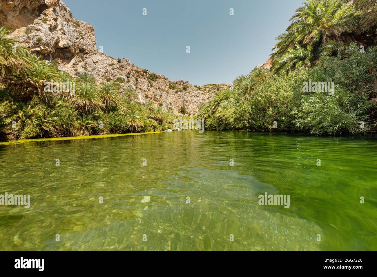 Preveli beach, River flowing from the mountains among palm trees, Crete ...