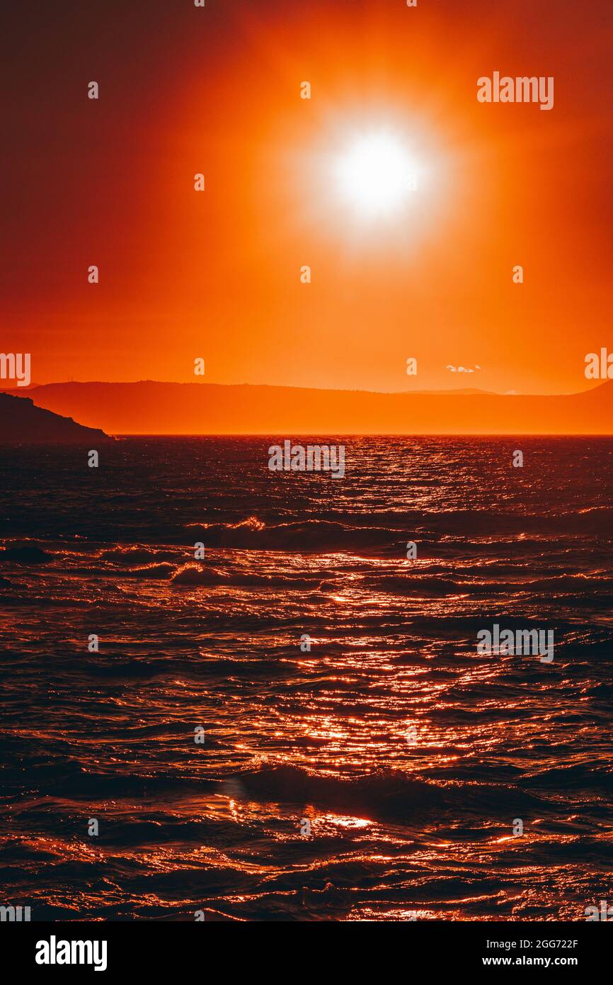 sunset over the sea, vertical landscape Stock Photo - Alamy