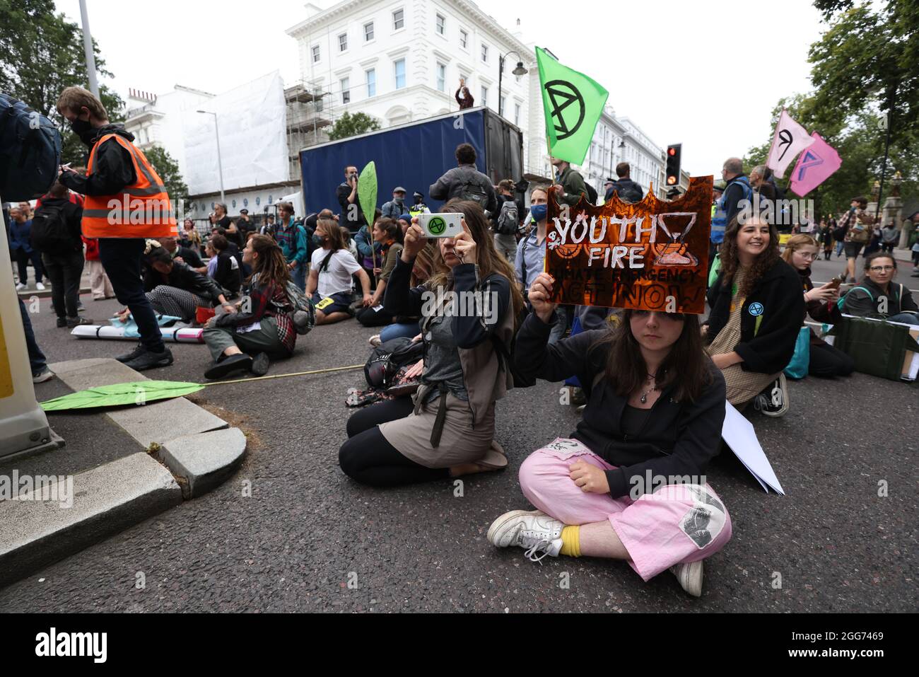 Demonstrators sit on the A4 outside the Natural History Museumduring a ...
