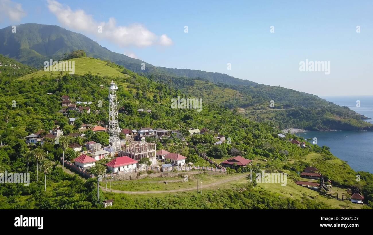 Aerial view of a village in Seraya Bali with hill and the sea Stock ...