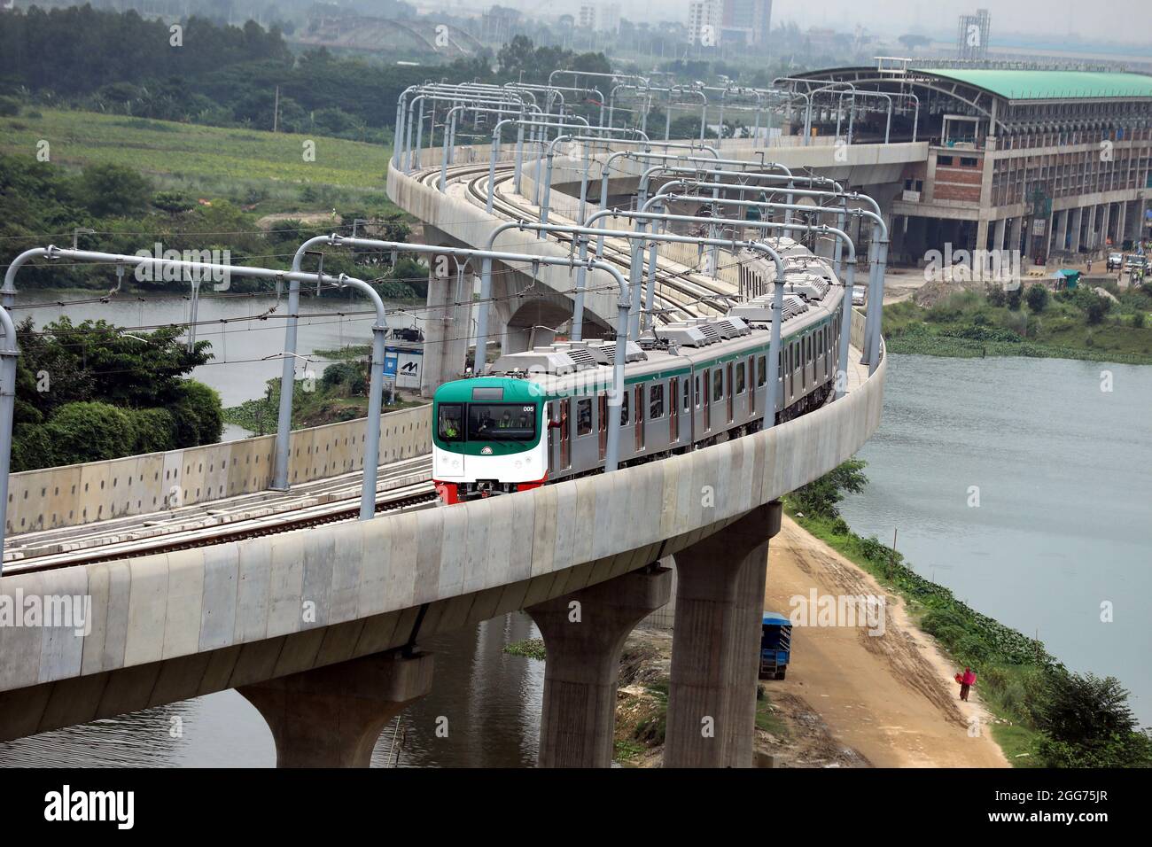 Aerial view of a pilot drives the electric metro rail train on the ...
