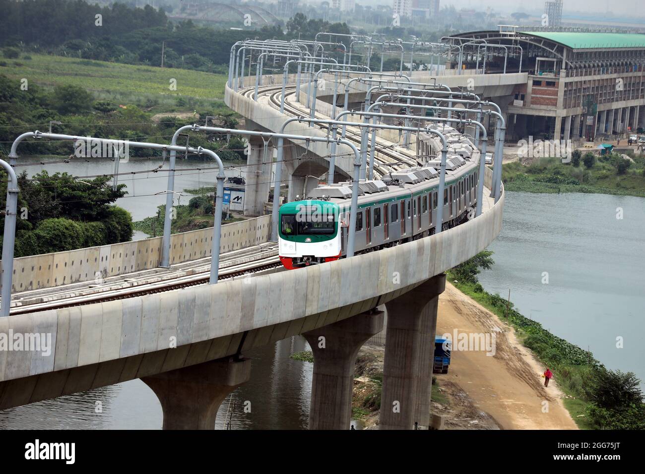 Aerial view of a pilot drives the electric metro rail train on the ...