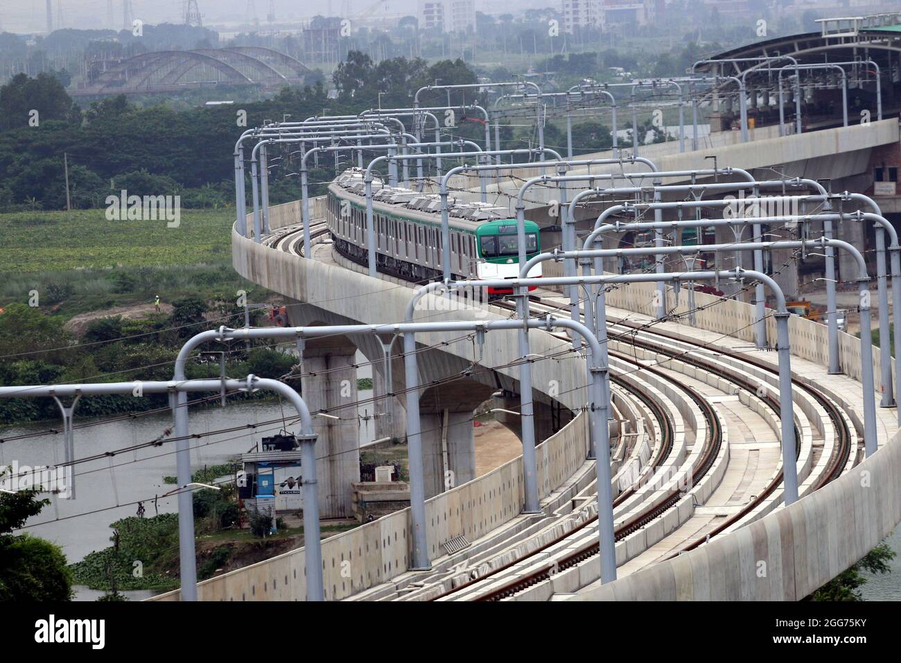 Aerial view of a pilot drives the electric metro rail train on the ...