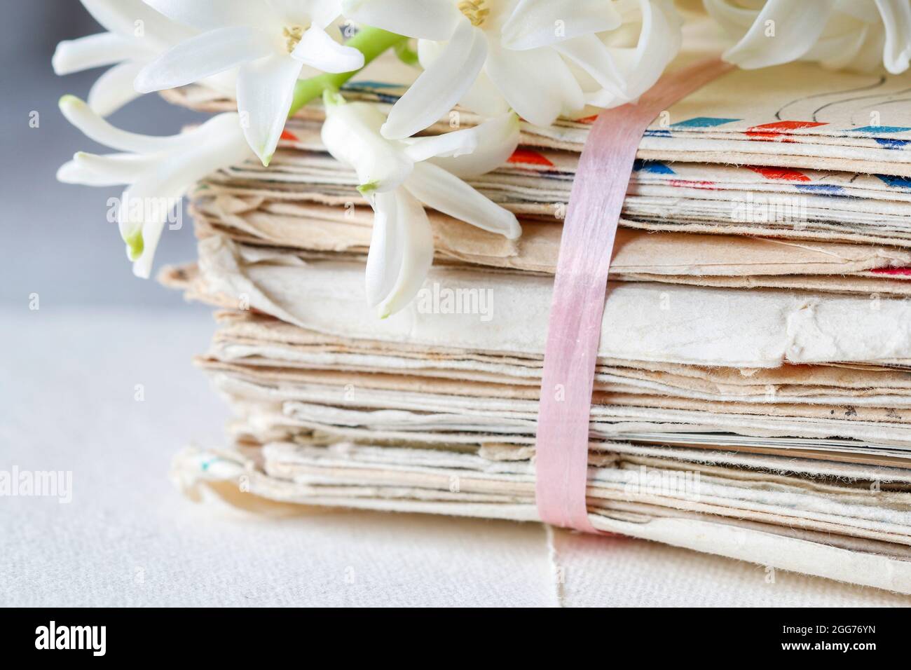 Stack of vintage letters and white hyacinth flowers. Retro style Stock ...
