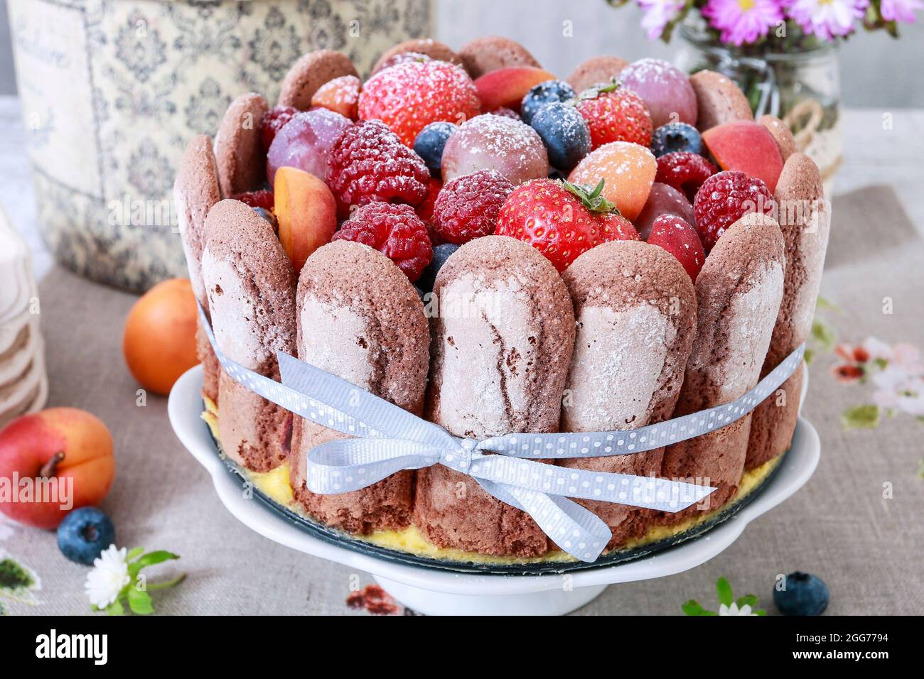 French charlotte cake with summer fruits. Party dessert Stock Photo - Alamy