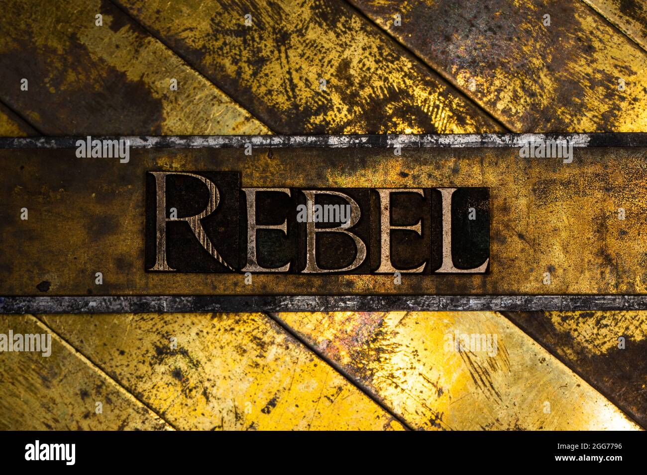 Rebel text over barbed wire on grunge silver with textured copper and ...