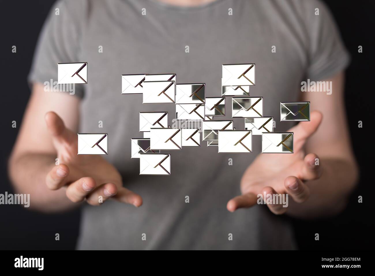 A network communications concept with floating letter signs in hands ...