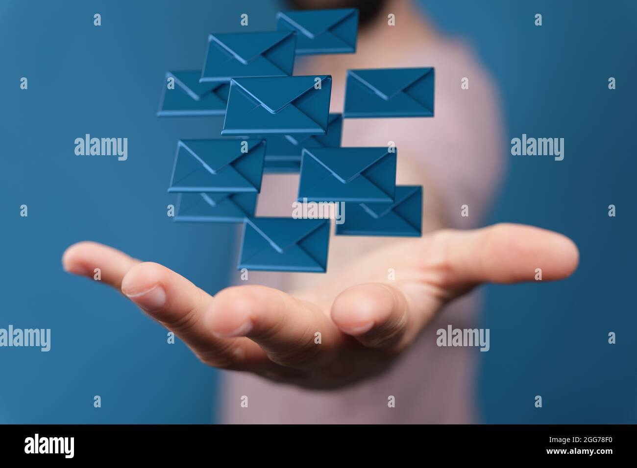 A network communications concept with floating letter signs in hands ...