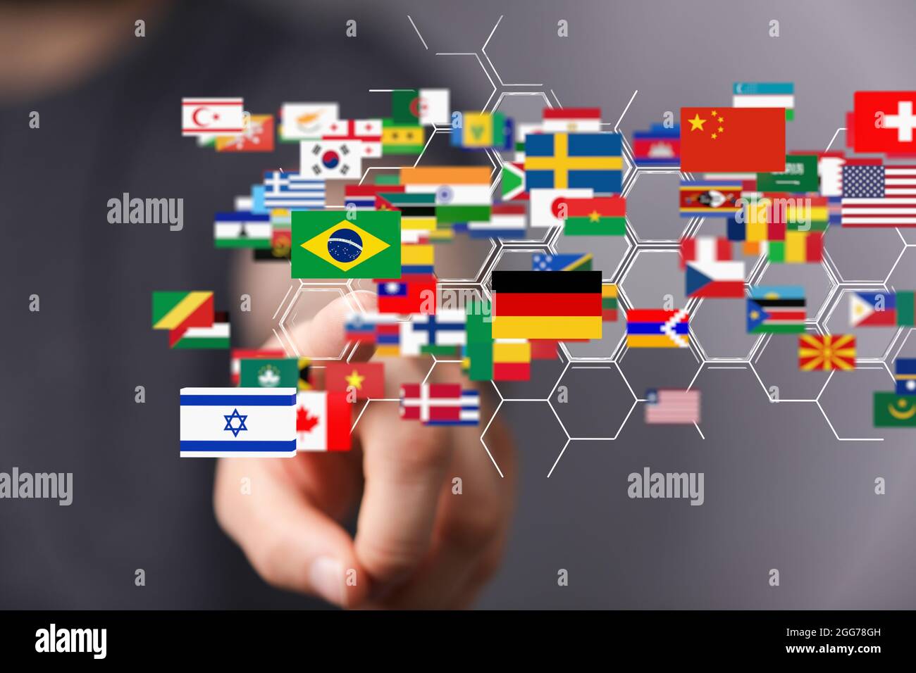 A finger touching a digital illustration of floating flags Stock Photo ...