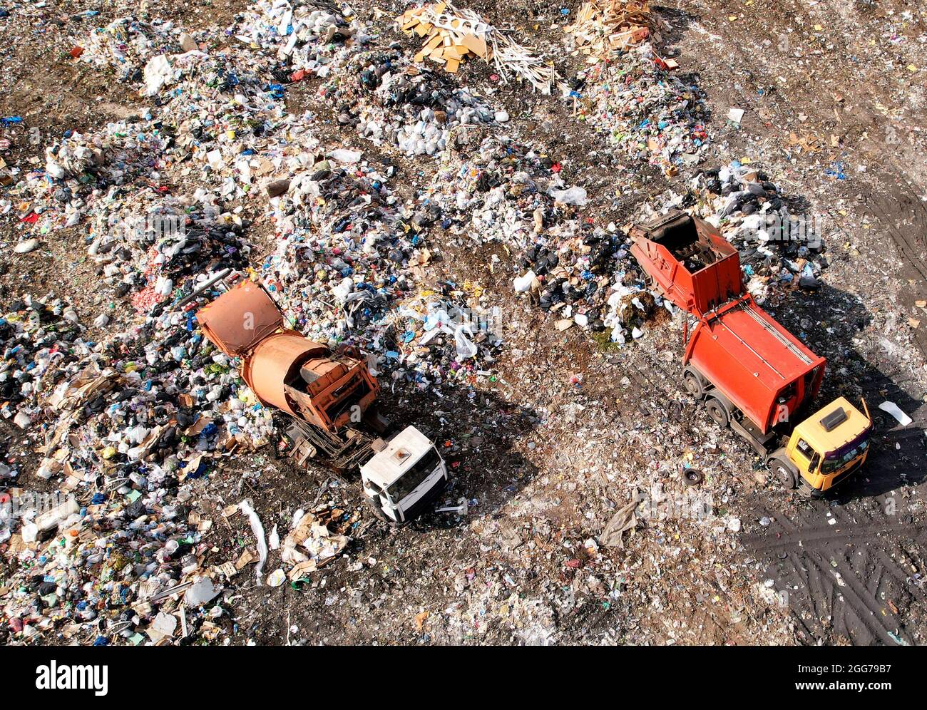 Garbage dump with food waste. Arial view of garbage truck unloads ...
