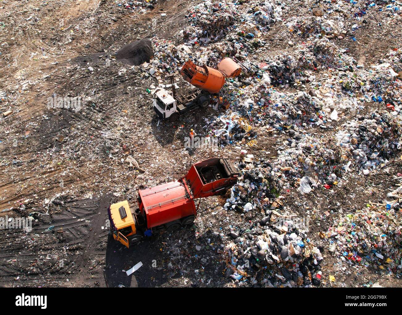 Garbage dump with food waste. Arial view of garbage truck unloads ...