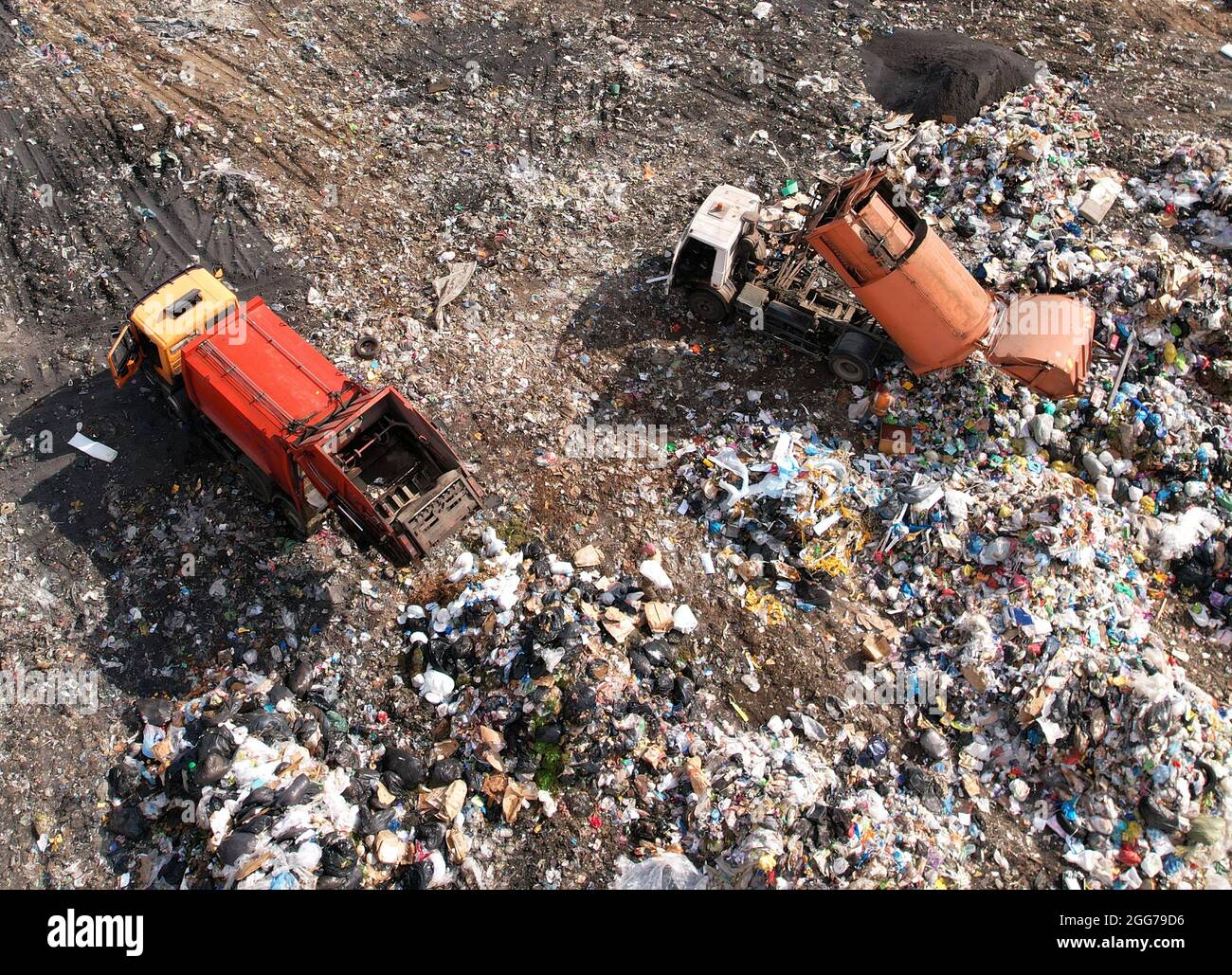 Garbage dump with food waste. Arial view of garbage truck unloads ...