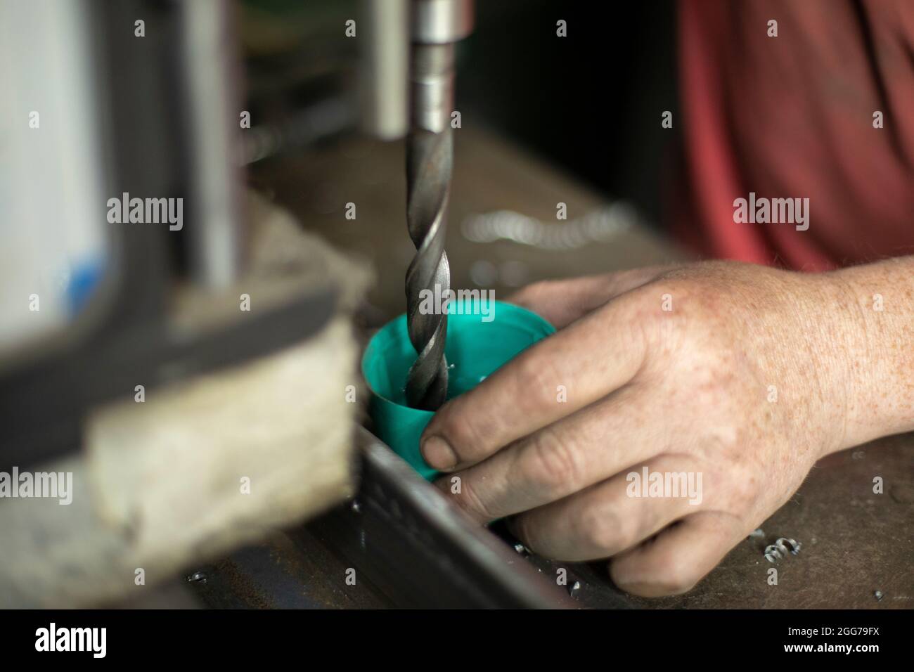 Cooling drill on a drilling machine. Work with a drill in a metal ...