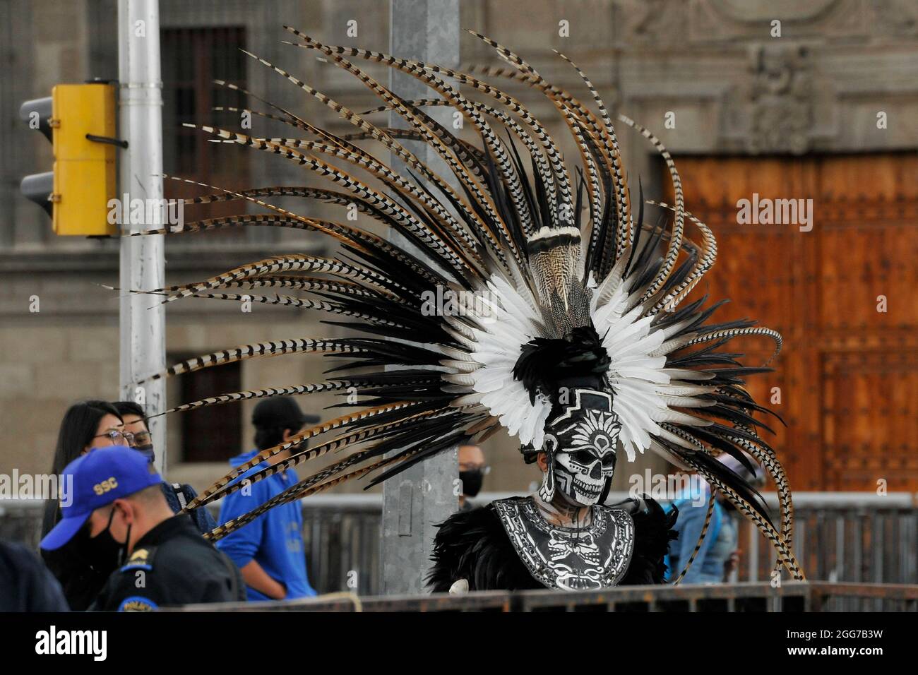 A man dressed as aztec warrior takes part during a ceremony before the ...