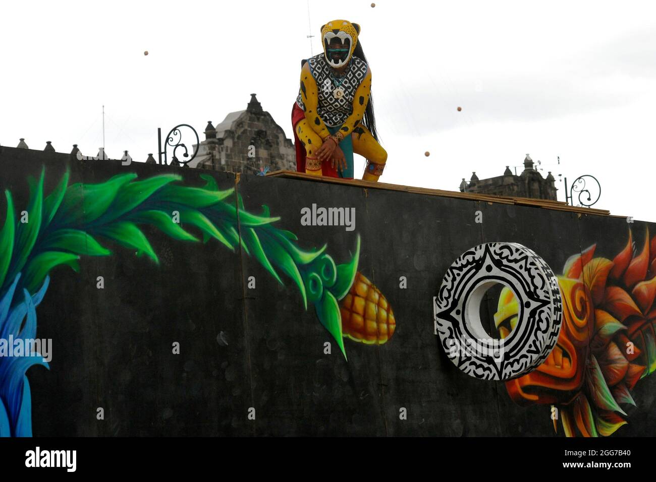 A man dressed as aztec warrior takes part during a ceremony before the ...