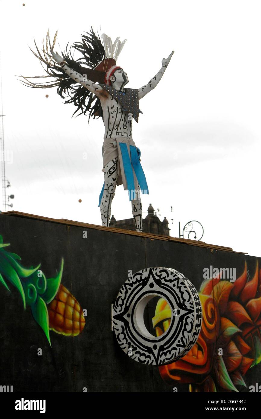 A man dressed as aztec warrior takes part during a ceremony before the ...