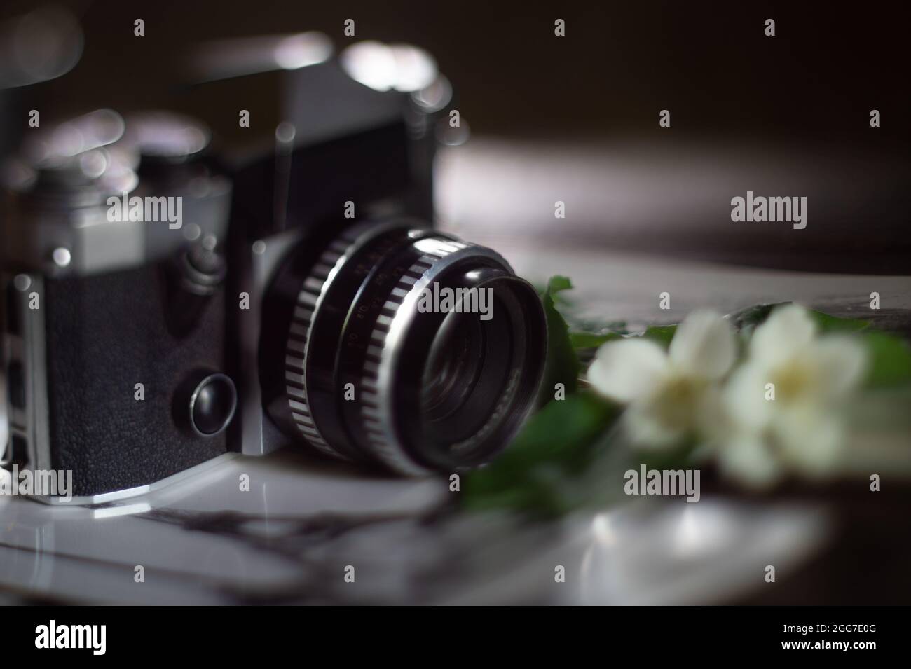 Old outdated camera and black and white photo in retro style Stock ...
