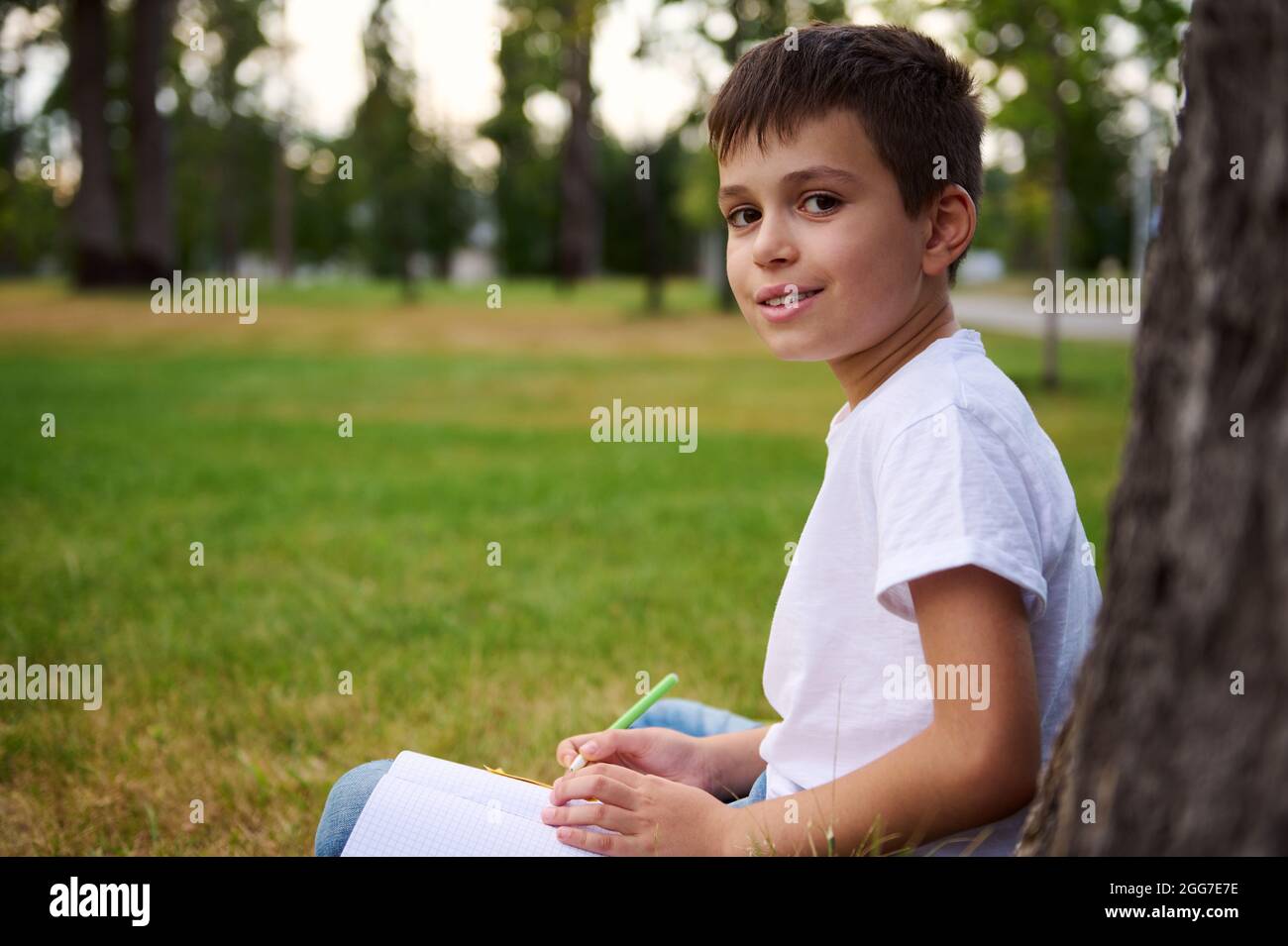 Side portrait of handsome elementary aged clever boy student ...