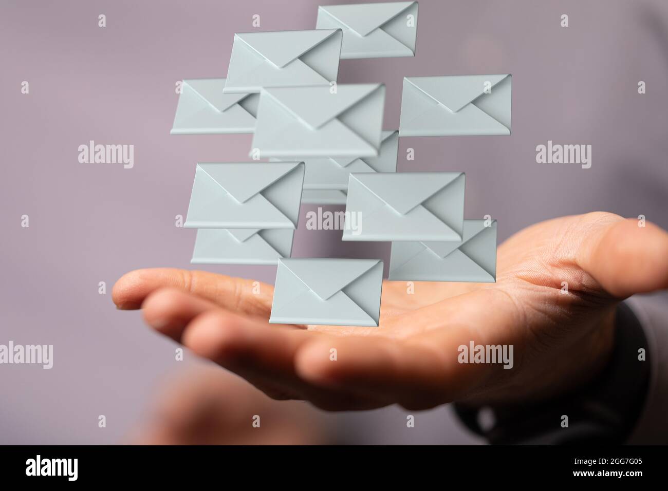 A network communications concept with floating letter signs on the hand ...