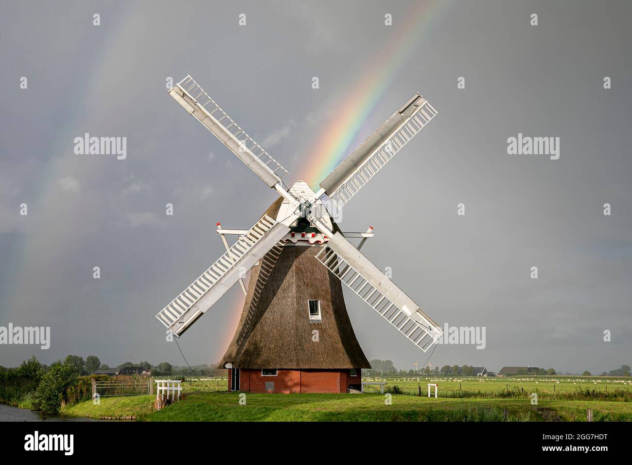 rainbow and Dutch windmill in summer, Holland Stock Photo - Alamy