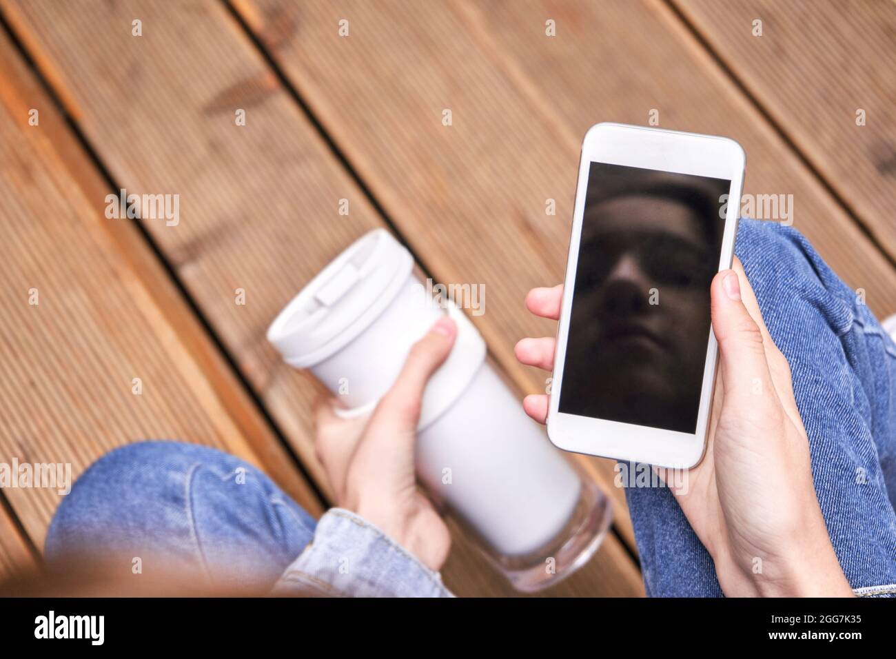 Pretty girl outdoors. Real people using mobile phone. Single female ...