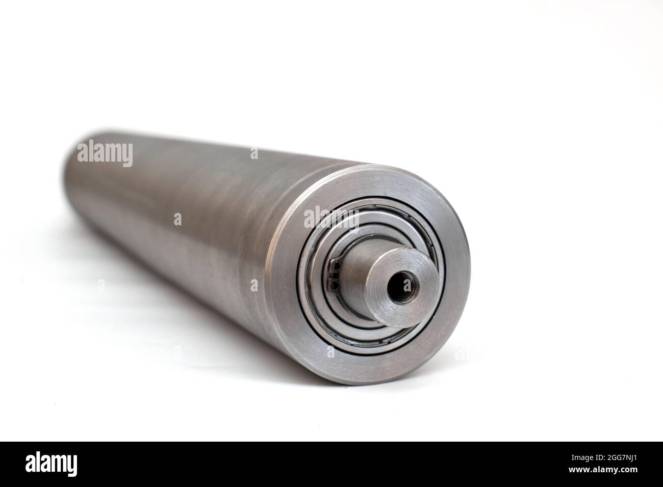 Steel metal pipe-shaft made on a lathe for the factory conveyor ...