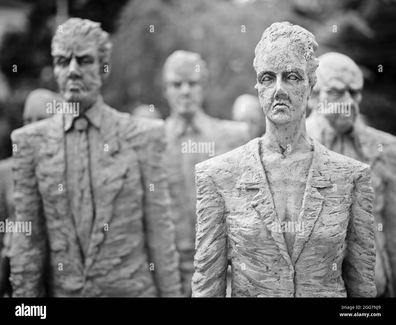 Statues of people walking down the street Stock Photo - Alamy
