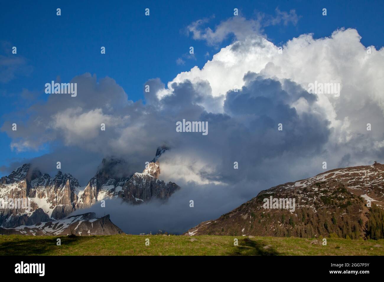 The cloudy sky over the snowy landscapes captured in high in the Alps ...