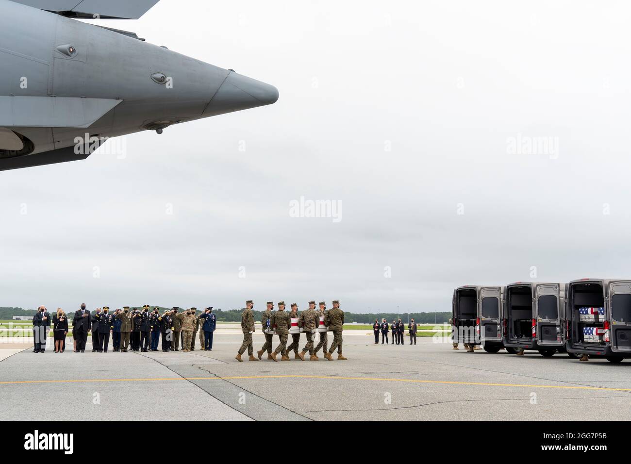 A U.S. Marine Corps carry team transfers the remains of Marine Corps ...