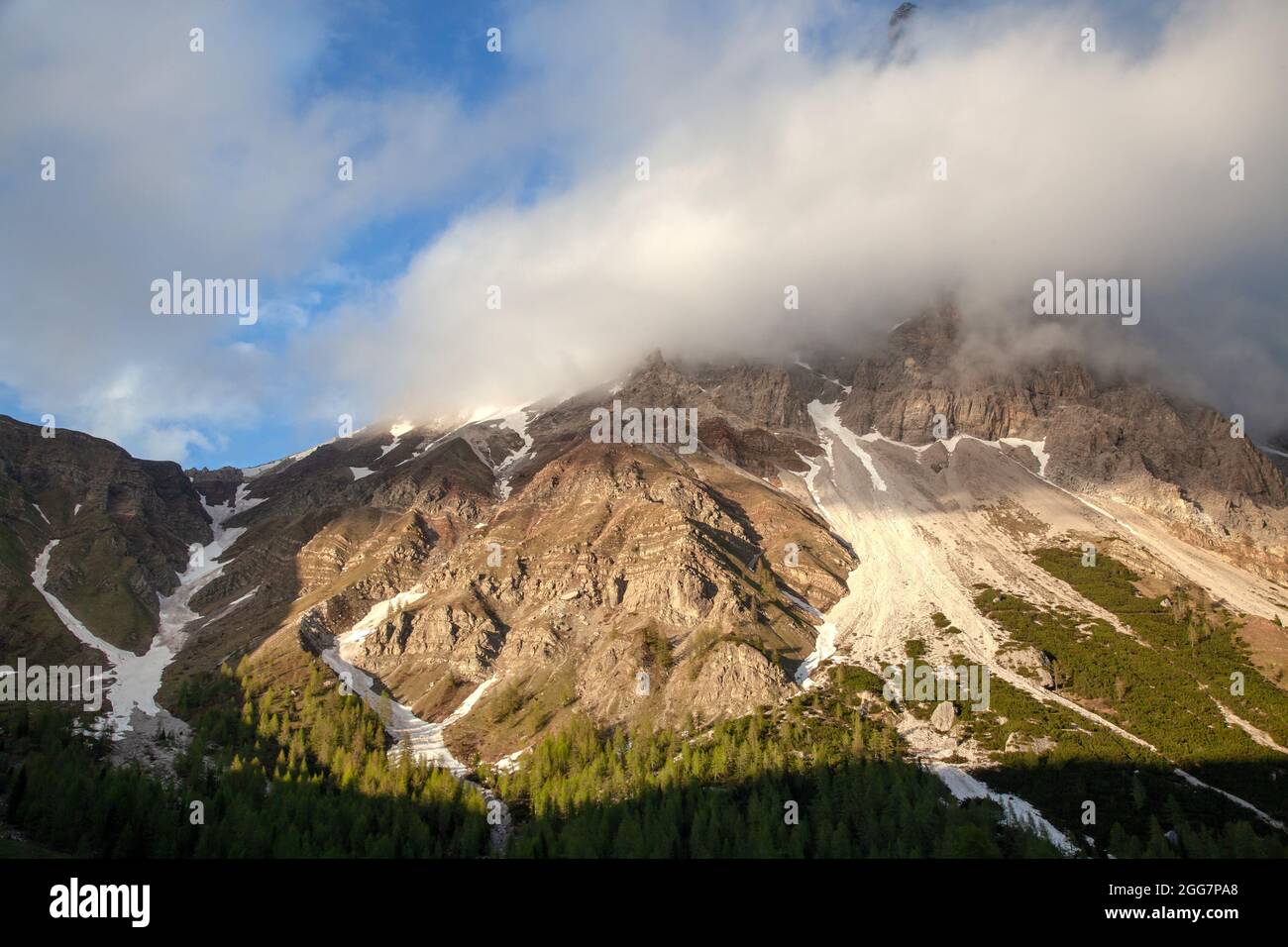 The cloudy sky over the snowy landscapes captured in high in the Alps ...