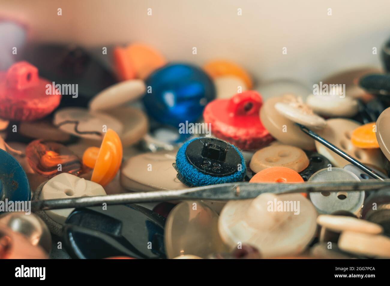 A selective shot of mix of cloth buttons of different color and size ...