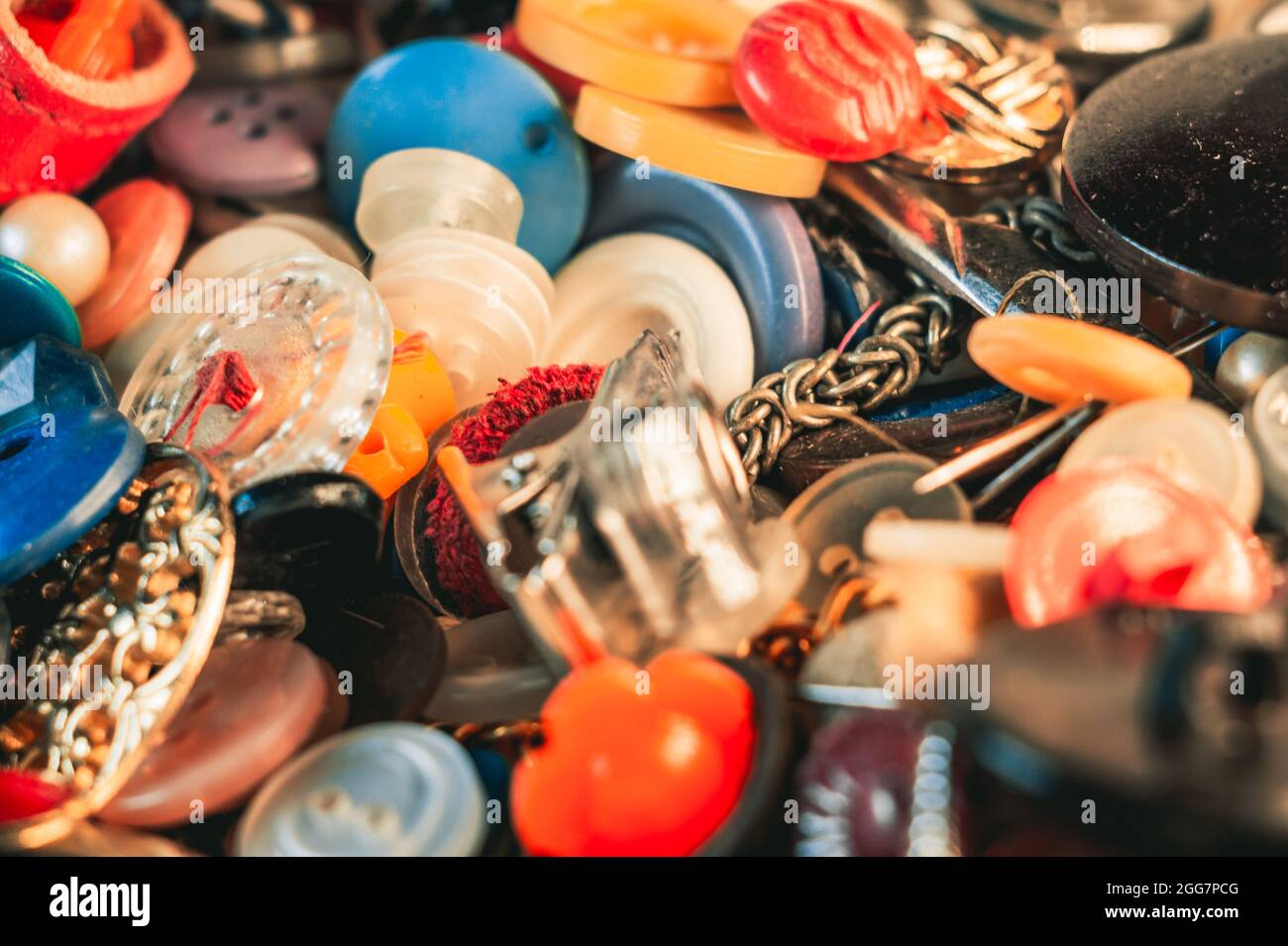 A selective shot of mix of cloth buttons of different color and size ...